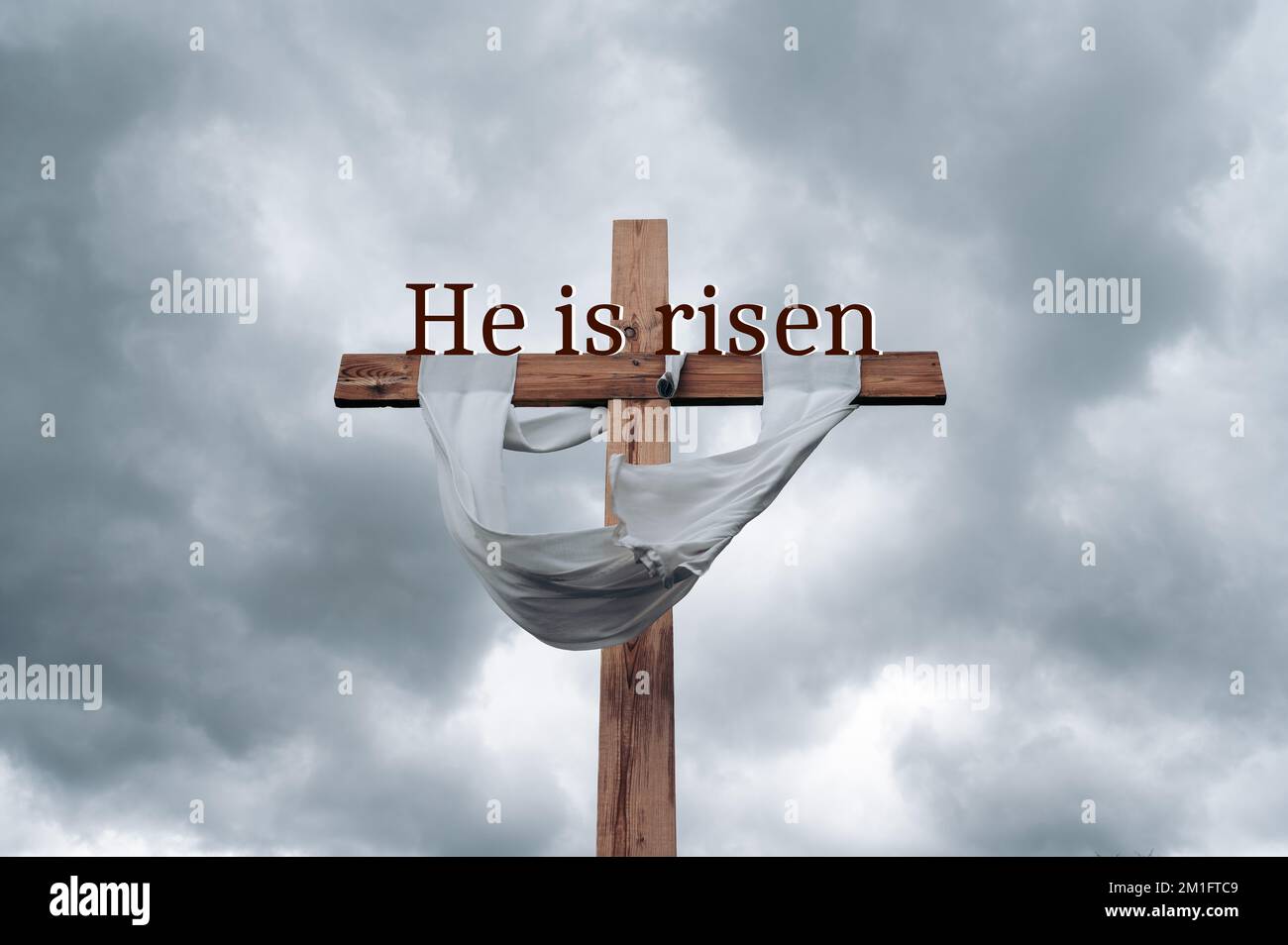 Wood cross on grey sky background with copy space for inscription. Good ...