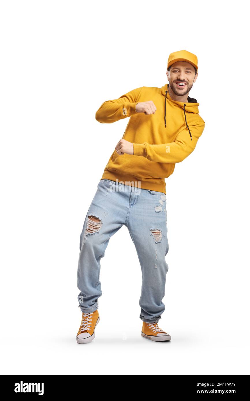 Young man in a hoodie and cap dancing isolated on white background ...