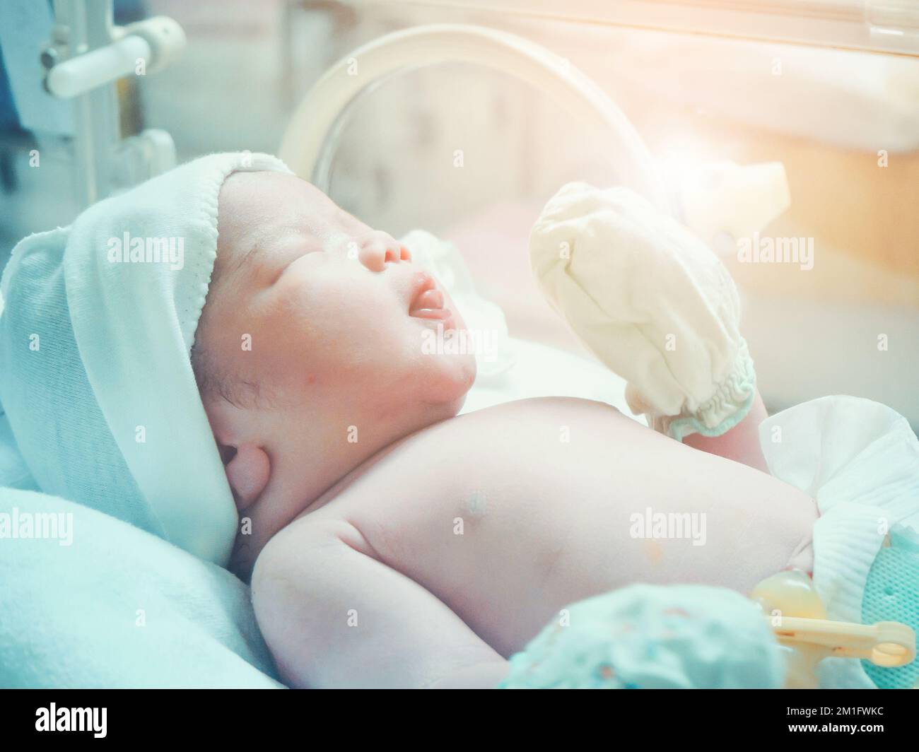 new born baby infant sleep in the incubator at hospital Stock Photo - Alamy