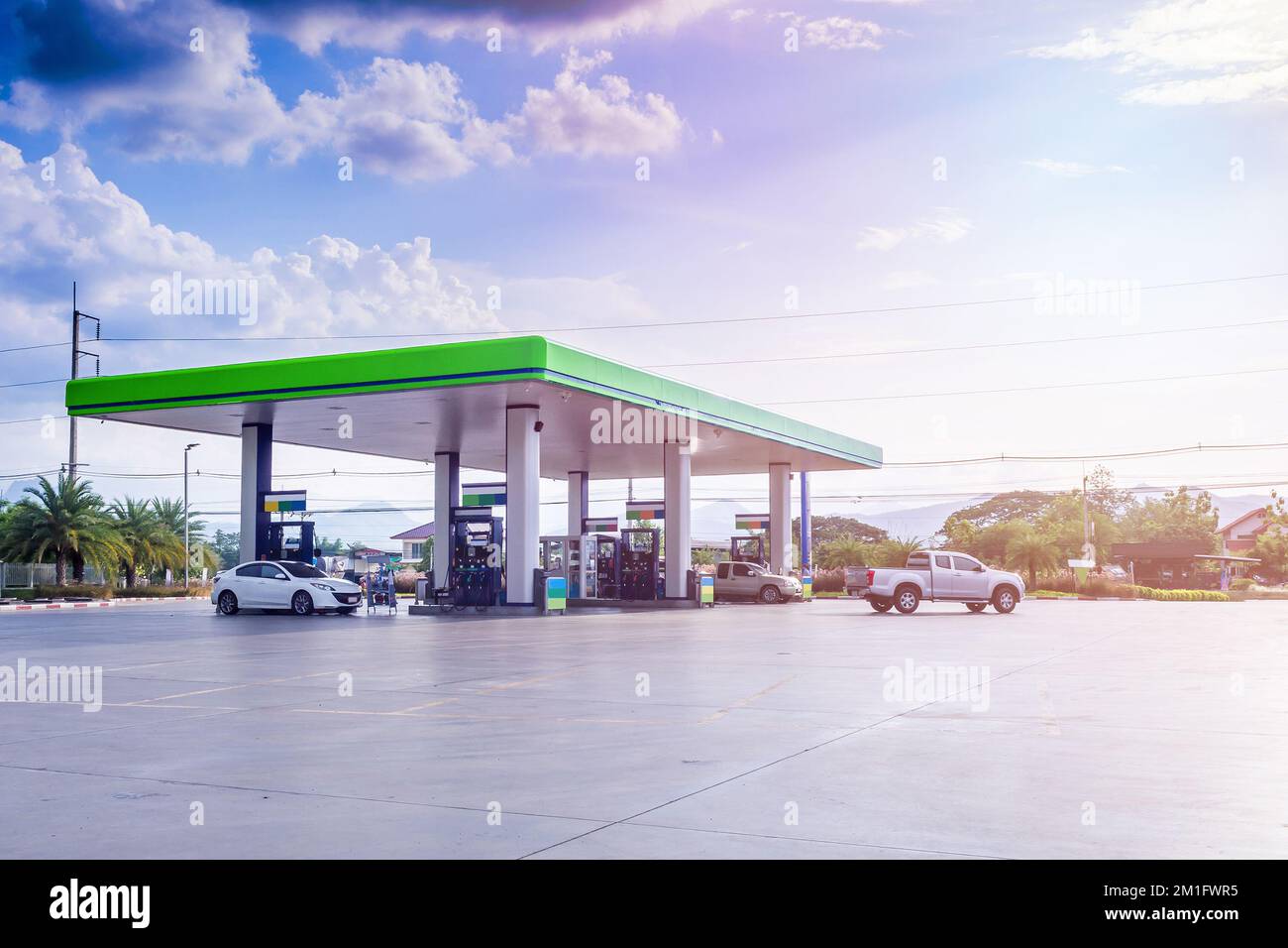 Gas fuel station with clouds and blue sky Stock Photo - Alamy