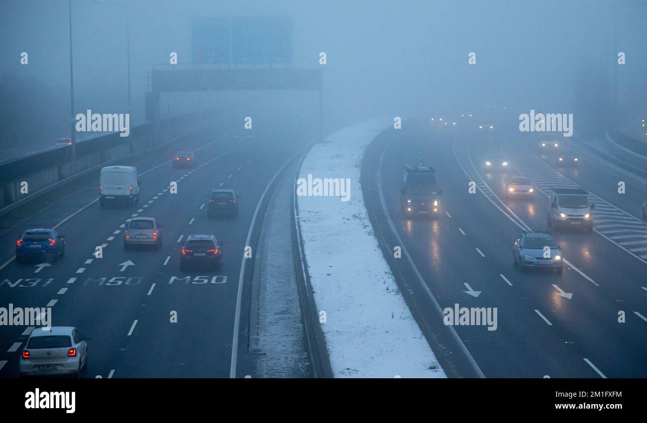 Commuters drive in freezing fog on the M50 motorway in Dublin during ...