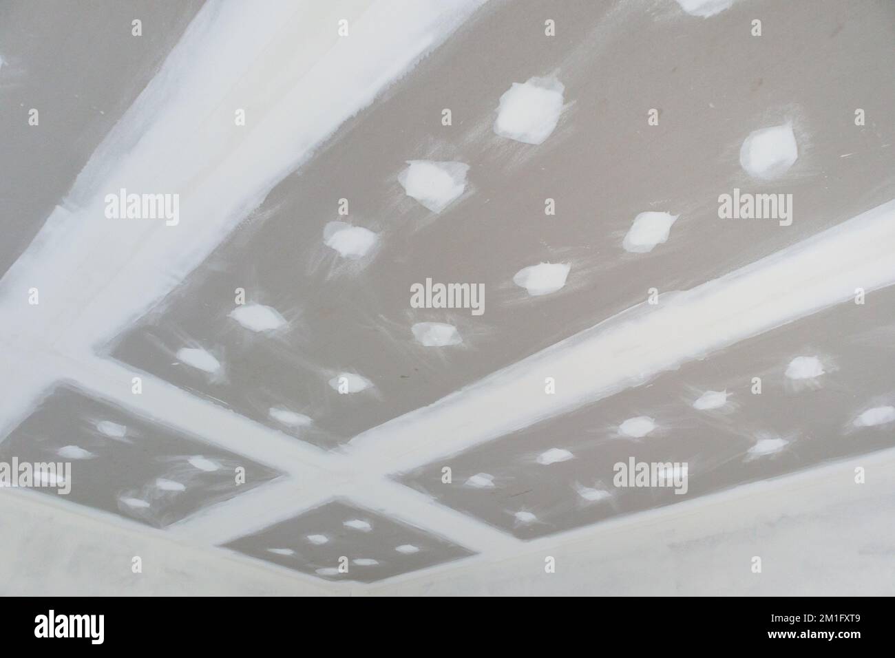 ceiling gypsum board installation at construction site Stock Photo - Alamy