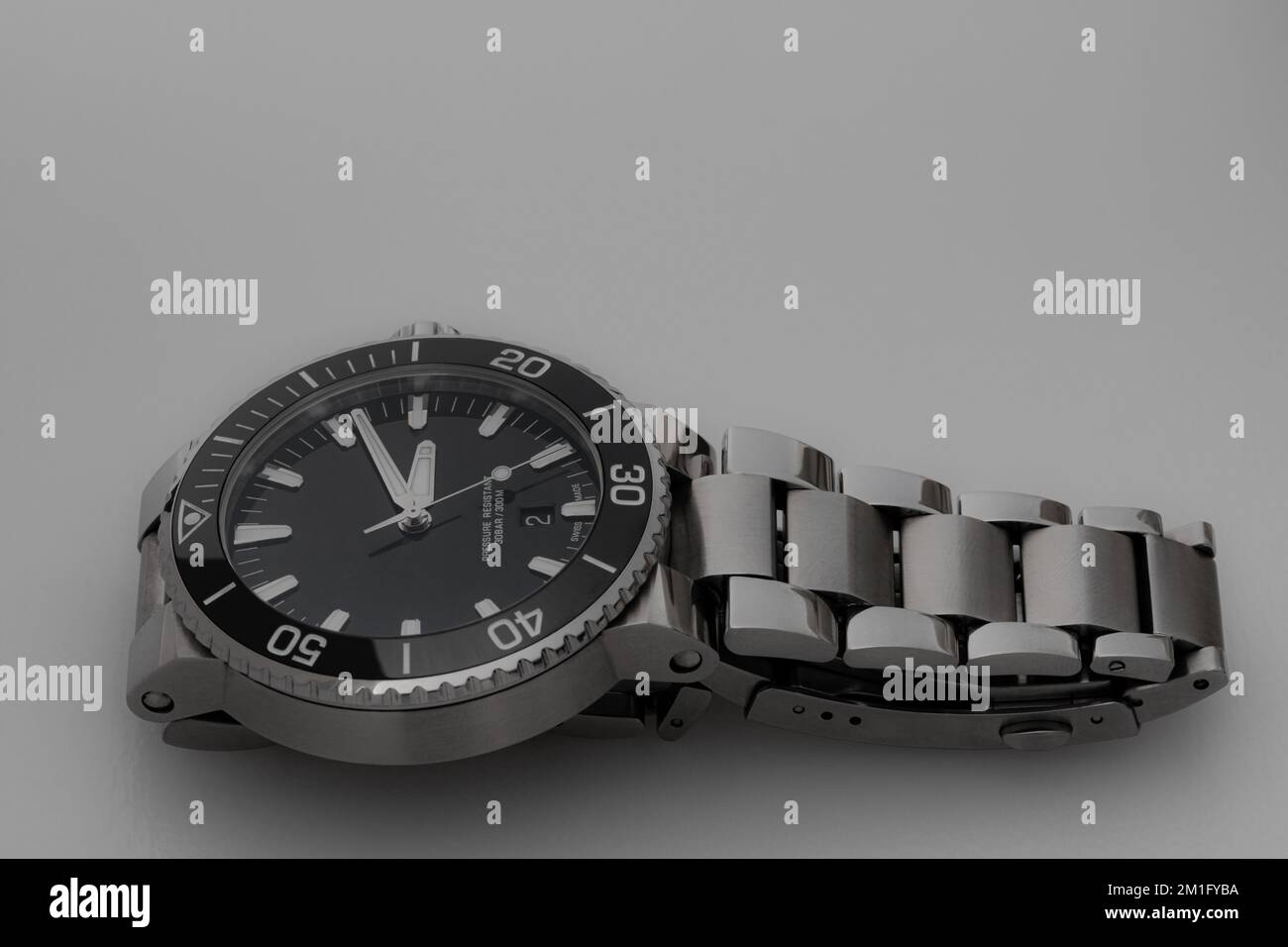 A Swiss made diver watch with steel bracelet, screw down crown, ceramic ...