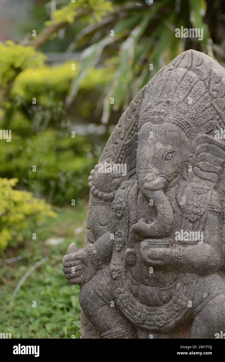 A ganesha stone statue in the garden in Thailand Stock Photo - Alamy