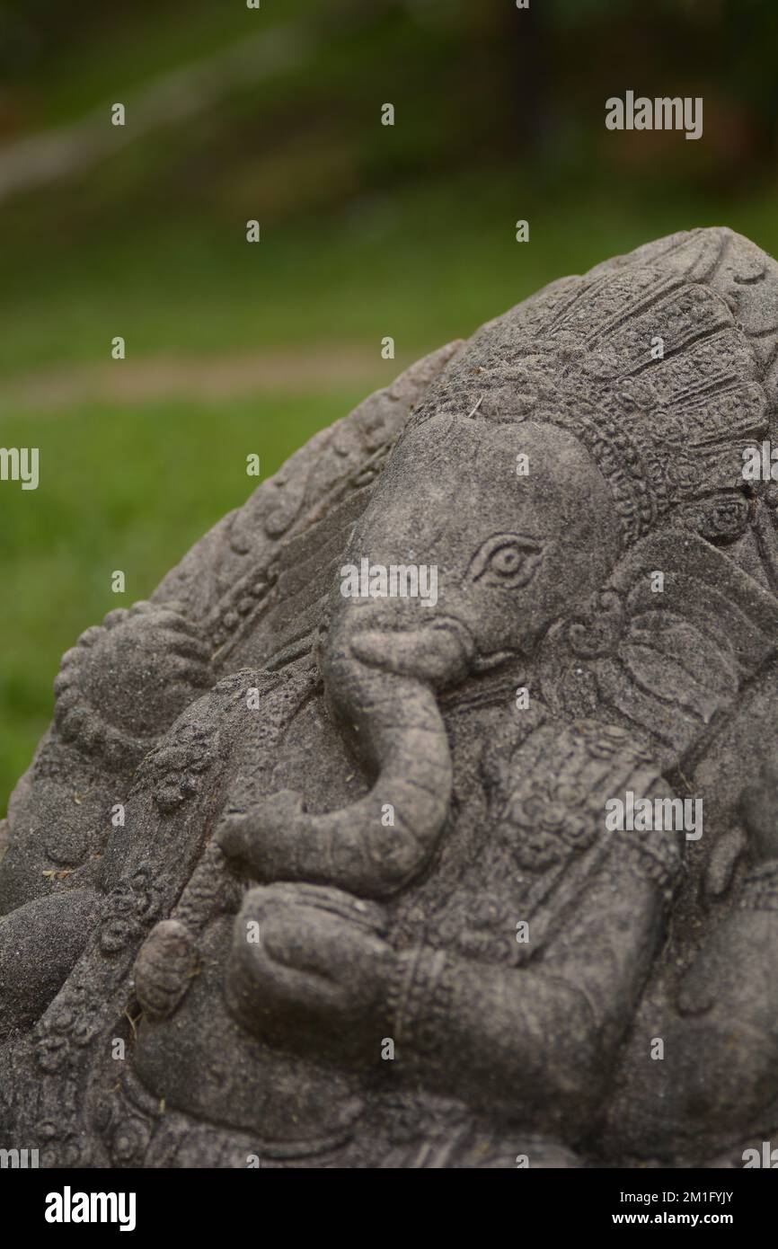 A ganesha stone statue in the garden in Thailand Stock Photo - Alamy