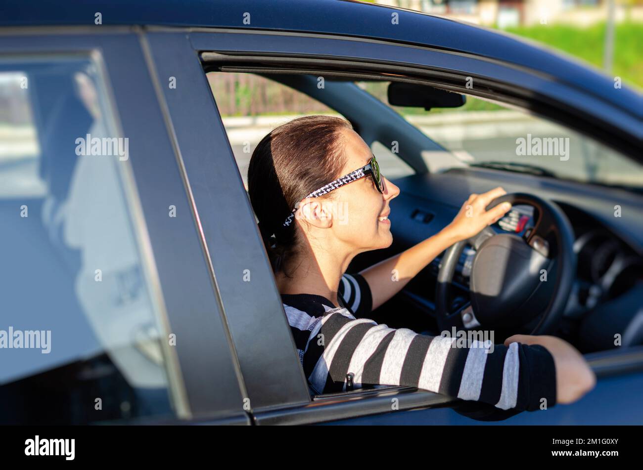 Woman driving race car hi-res stock photography and images - Alamy