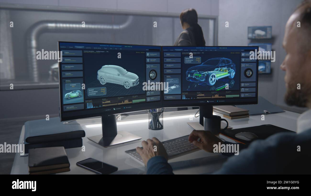 Car design engineers in a lab testing the aerodynamics and body of a ...