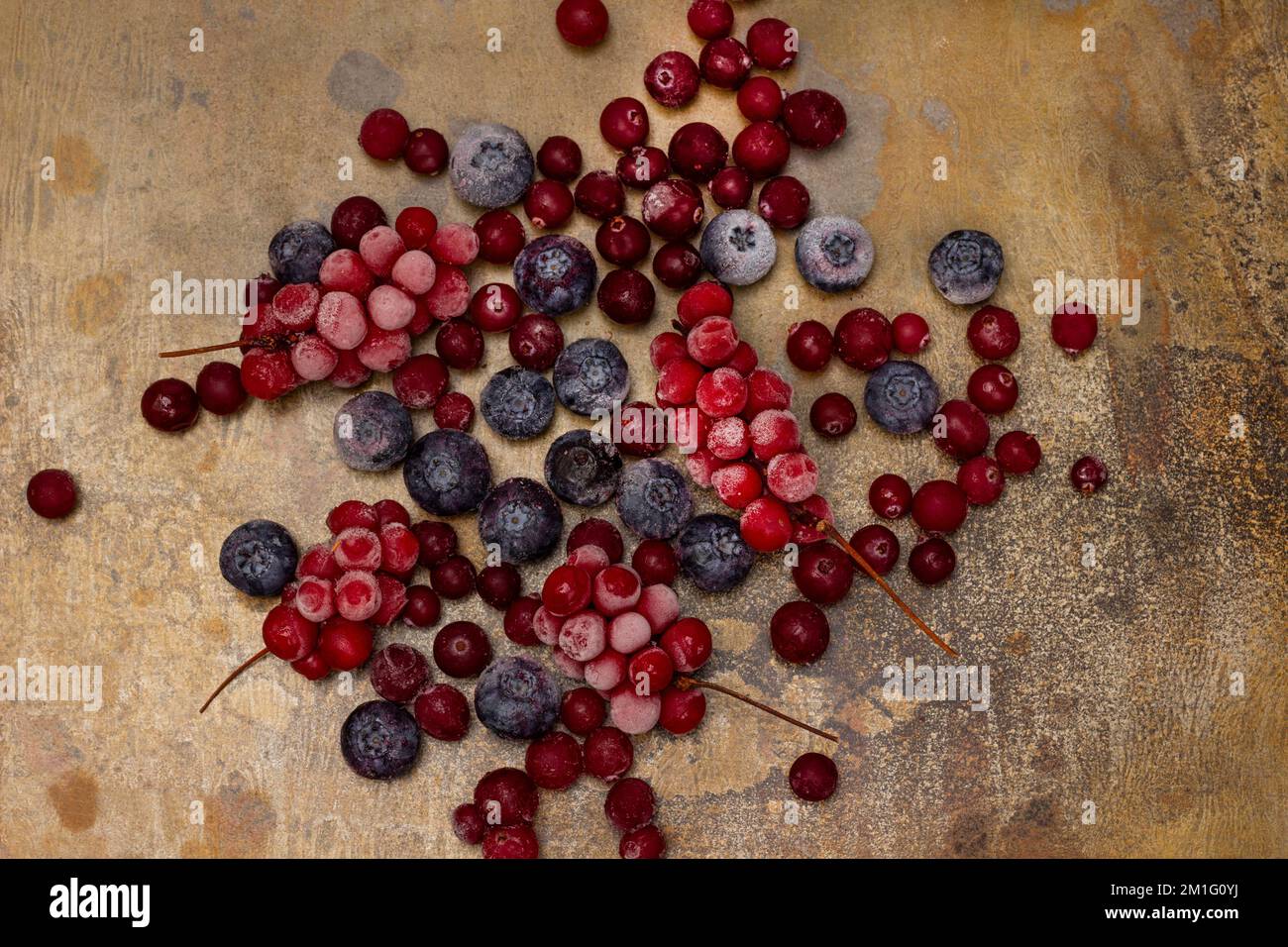 Frozen berries: blueberries, cranberries and bunches of red berries ...