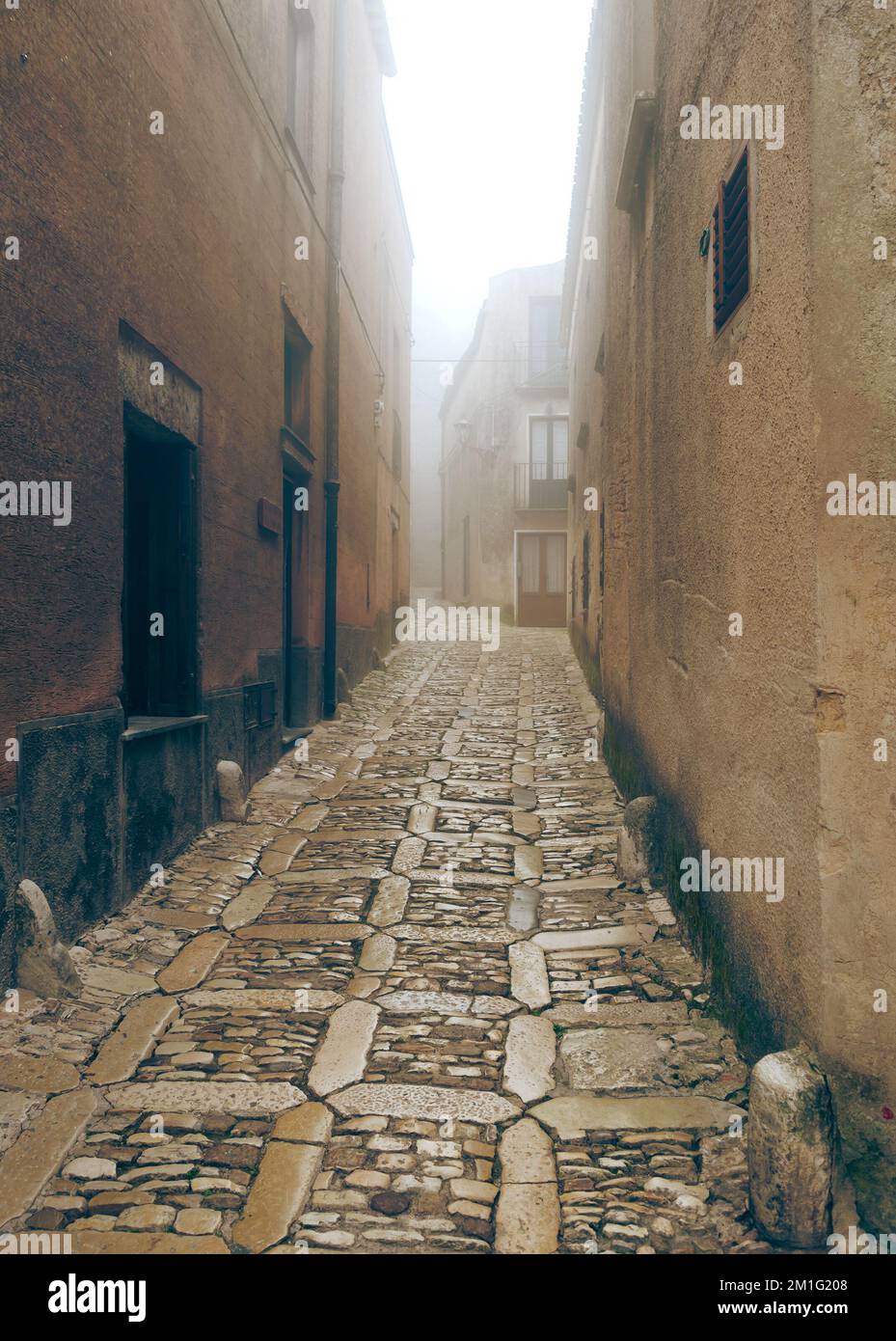 A traditional narrow stone lane in Erice Stock Photo - Alamy