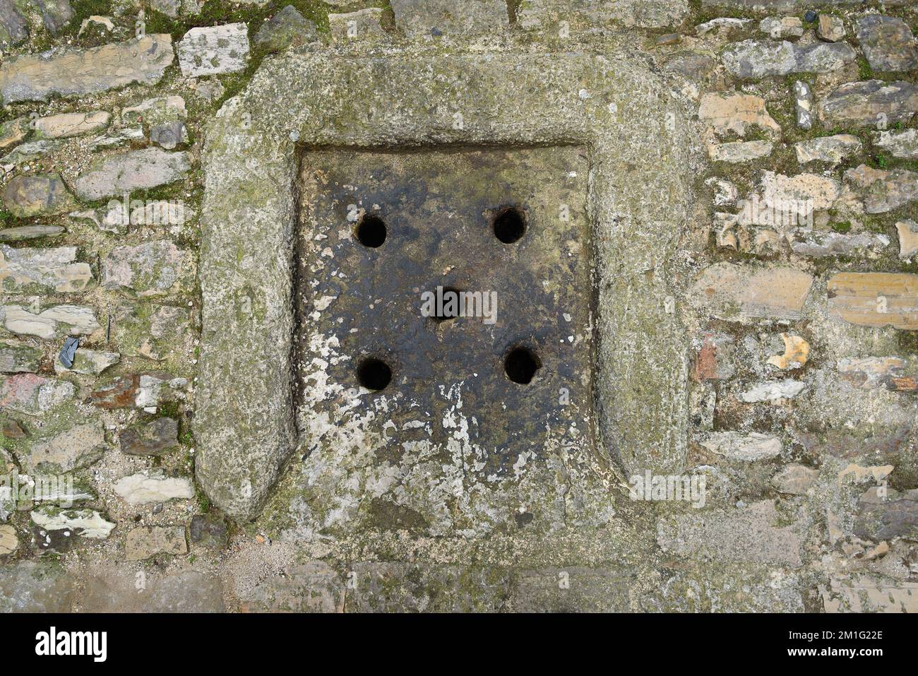 Street sewage on the stone road Stock Photo - Alamy