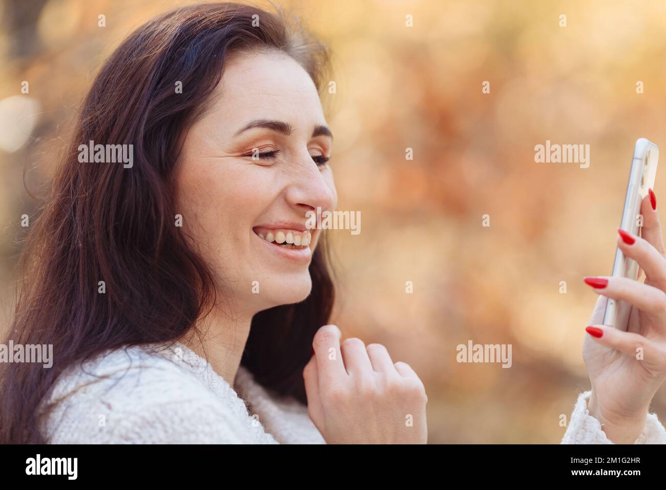 Dream big. Smiling female holding card for following your dreams. High ...