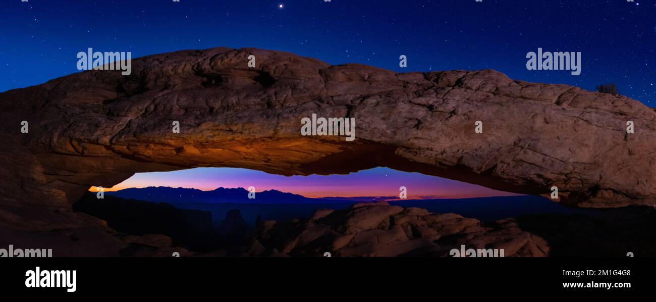 A breathtaking panoramic view of Mesa Arch in Canyonlands National park ...