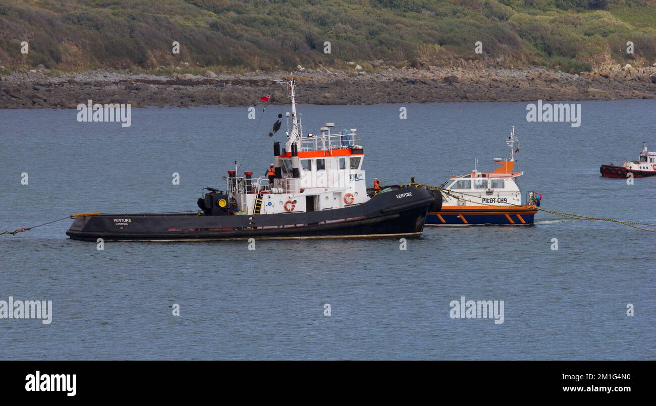 Tug vessel and pilot boat. Transferring pilot to the tug before it ...