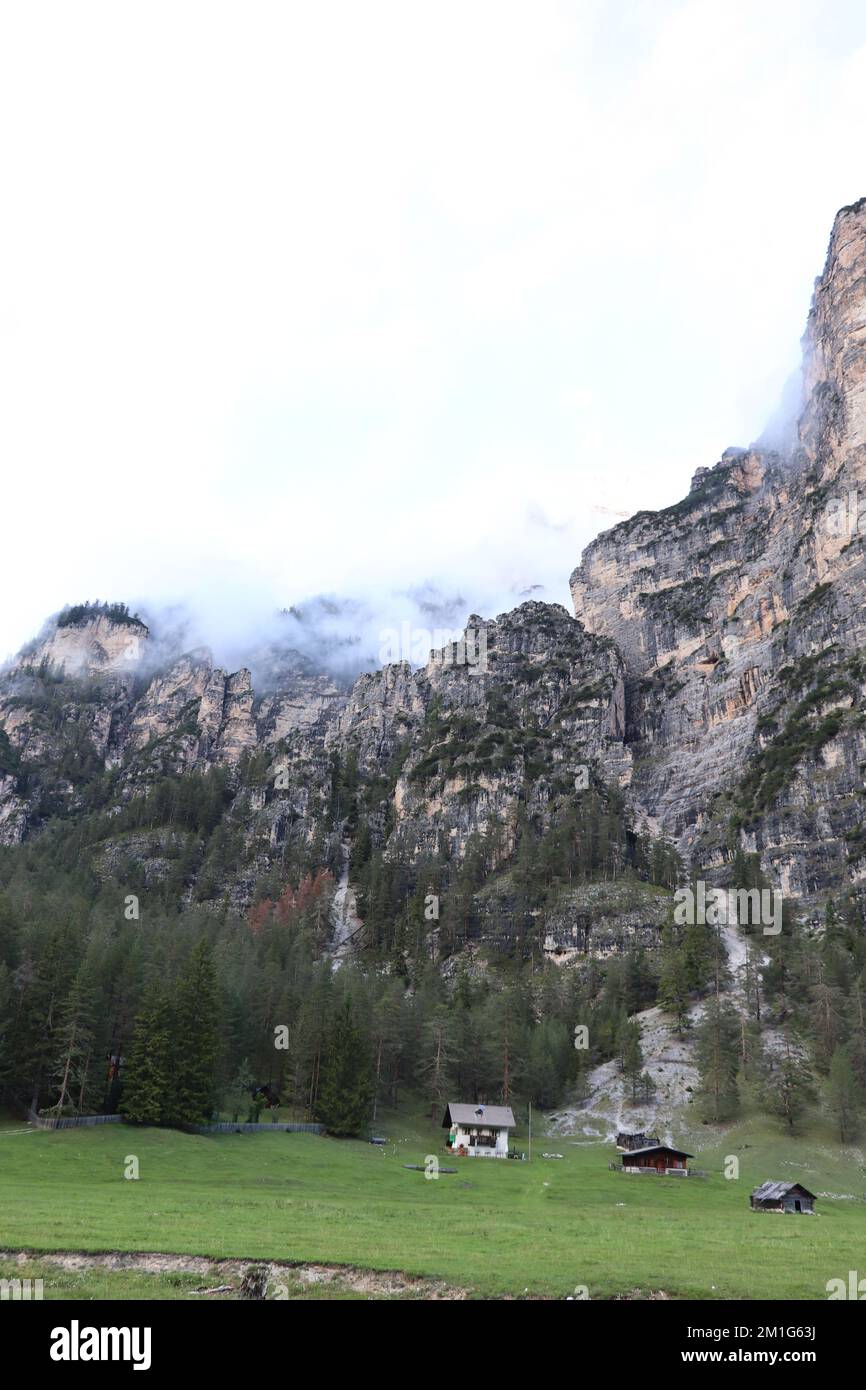 A landscape of Dolomites mountains alps with foggy sky in Trentino ...