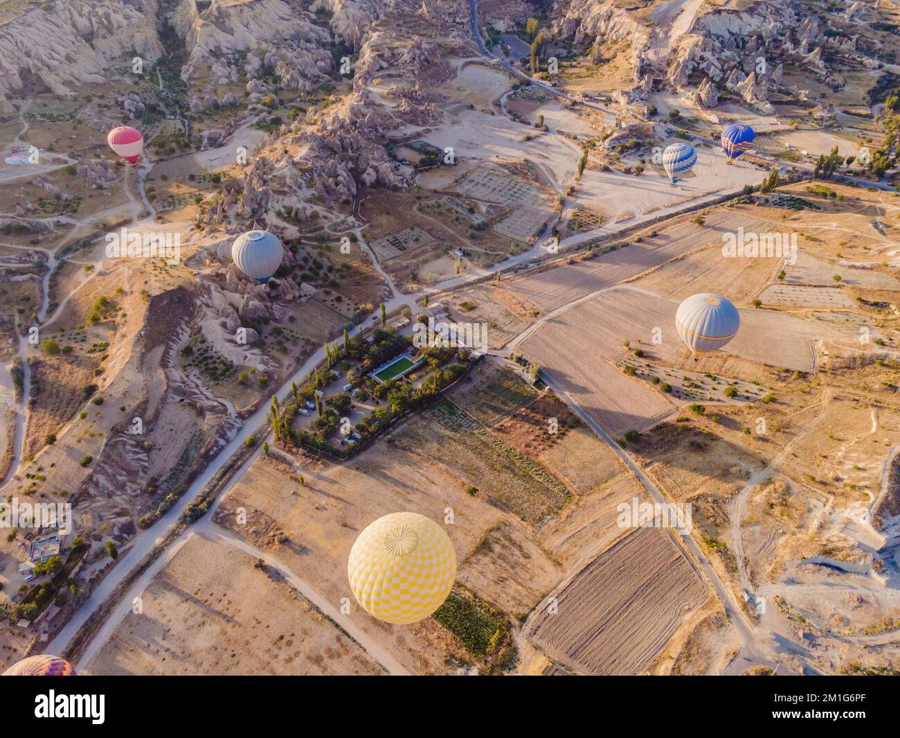 Colorful hot air balloons flying over at fairy chimneys valley in ...