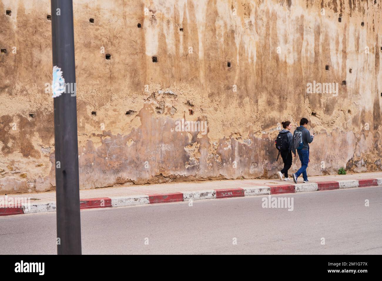 two students walking in the street Stock Photo - Alamy