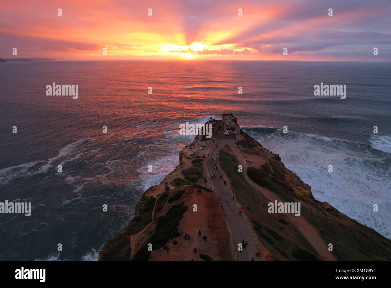Beautiful sunset ower the Fort of Nazare with Lighthouse, Portugal ...
