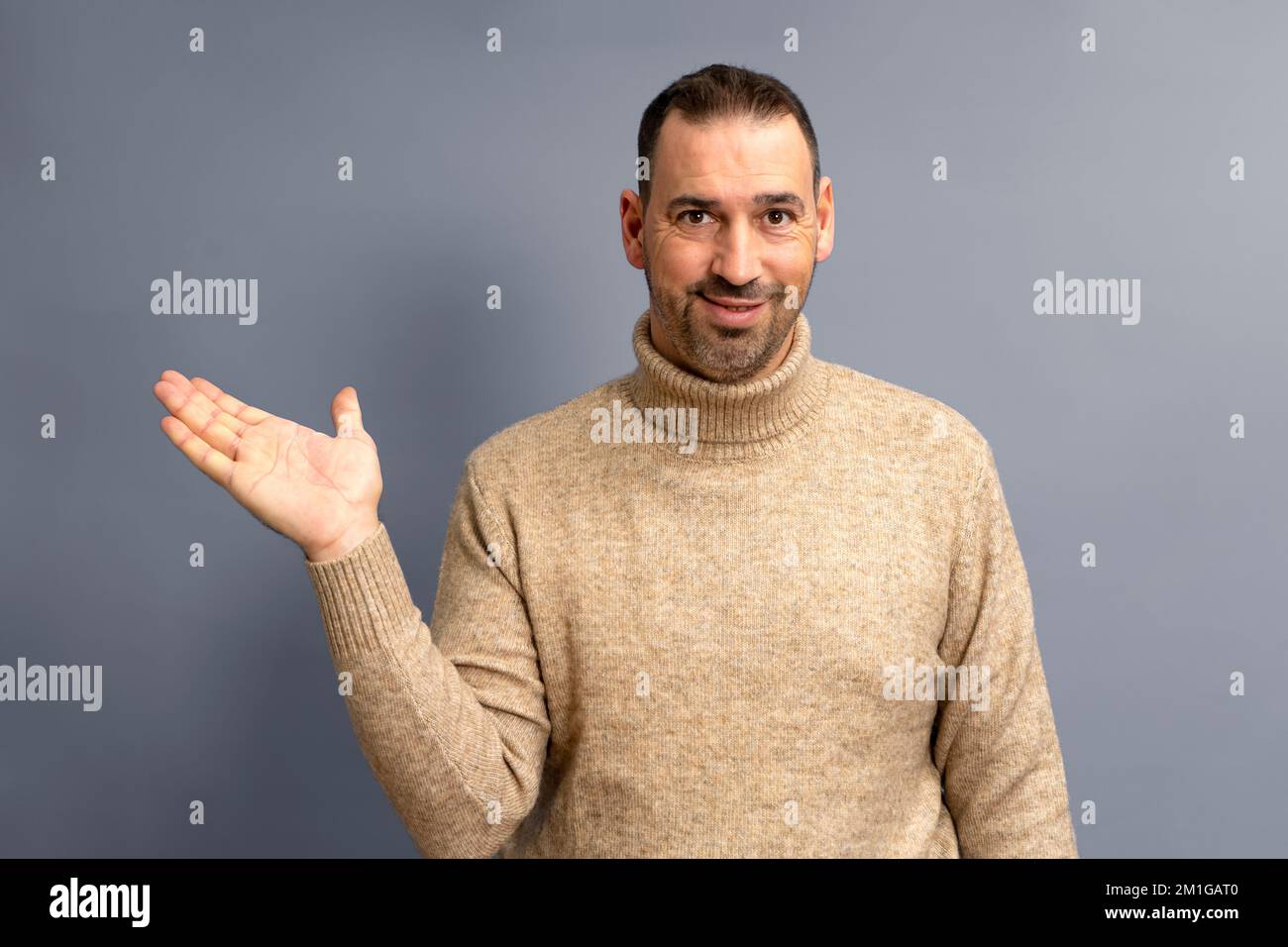 Hispanic man with beard and brown turtleneck sweater in friendly ...