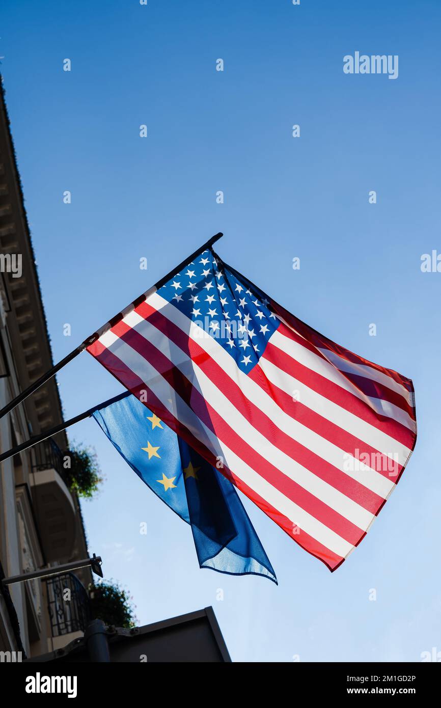 Flags of USA and European union on the building of united states ...