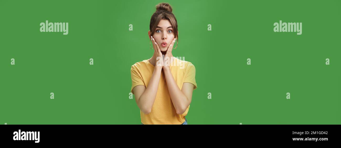 Silly cute and tender young female model with cleacn skin folding lips ...