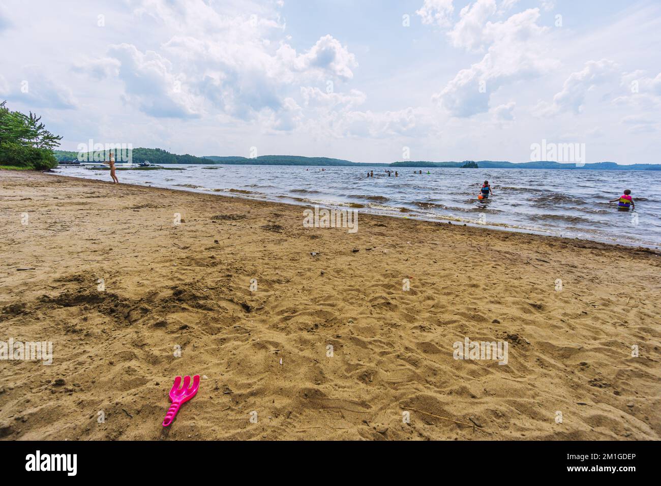 Vacationers enjoying lake Dwight beach, Muskoka, Ontario, Canada Stock ...