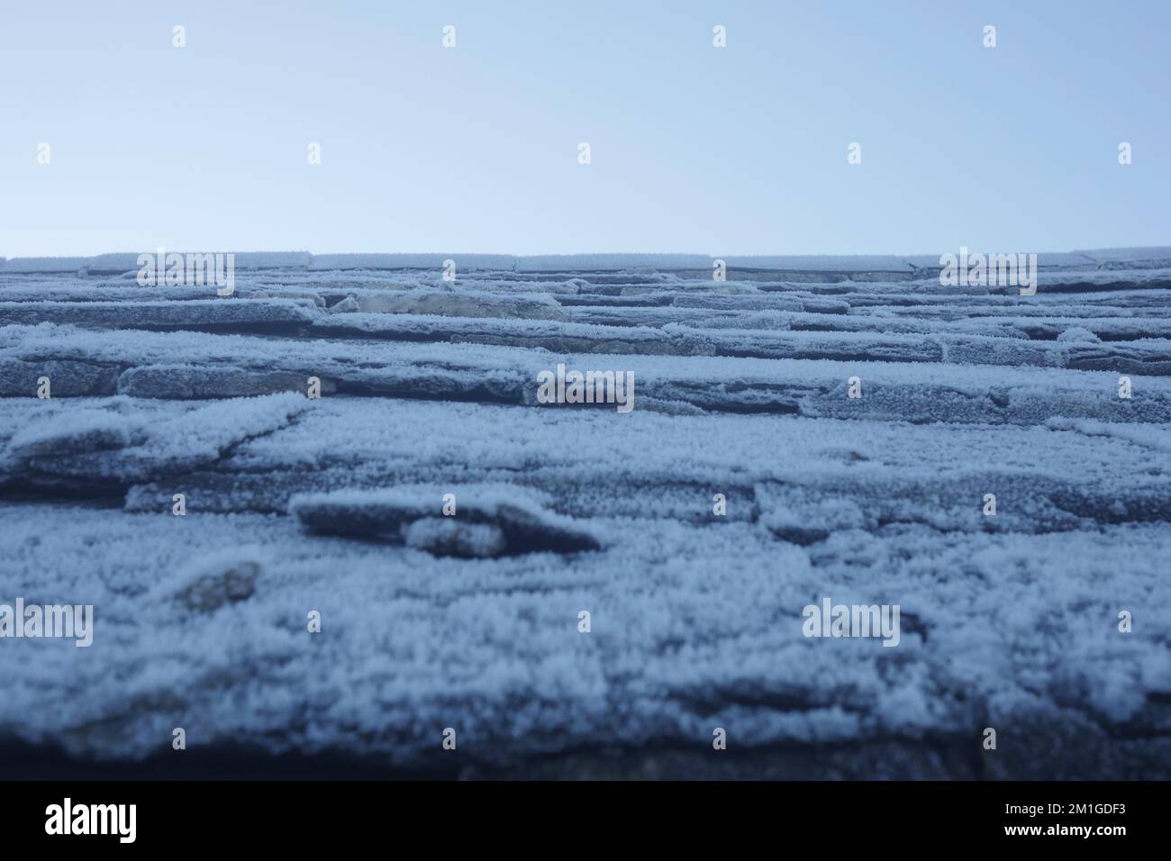 A Liscannor stone roof covered in a heavy layer of frost Stock Photo ...