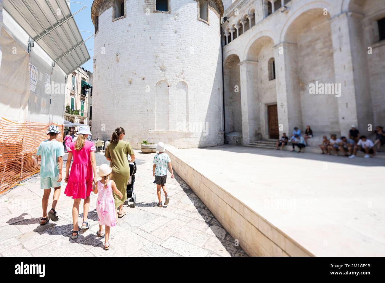 Family of tourists waking in streets Bari, Puglia, South Italy Stock ...