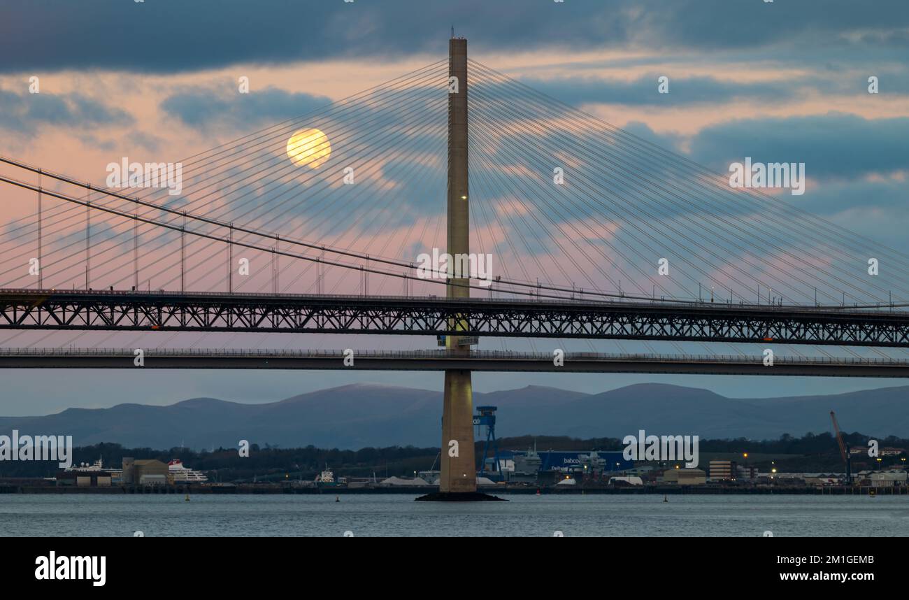 A full moon sets over Queensferry Crossing and Forth Road bridges in ...