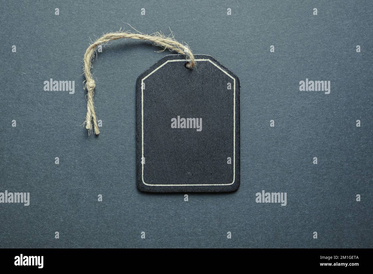black price tag on the black background, black mockup Stock Photo - Alamy