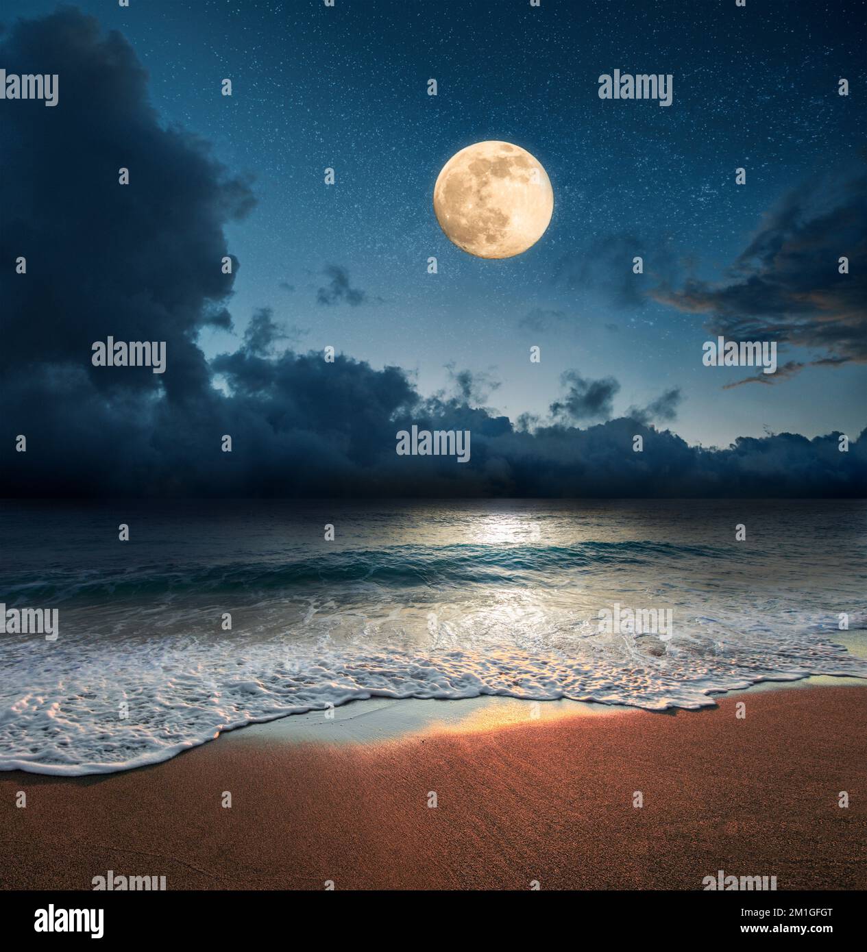 Sandy beach and moon at night Stock Photo - Alamy