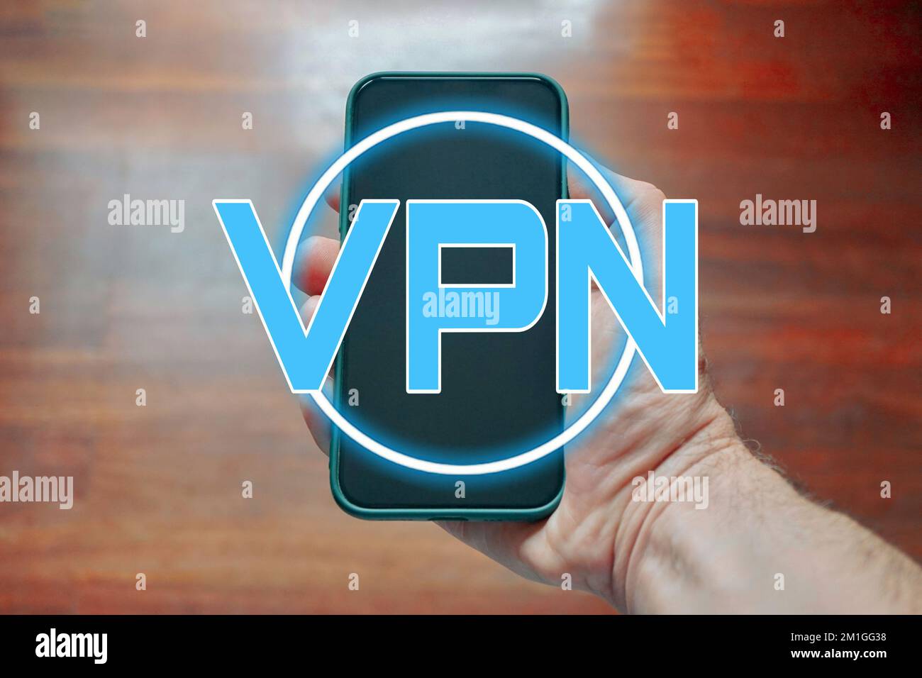hand holding a smart phone with vpn icon Stock Photo - Alamy