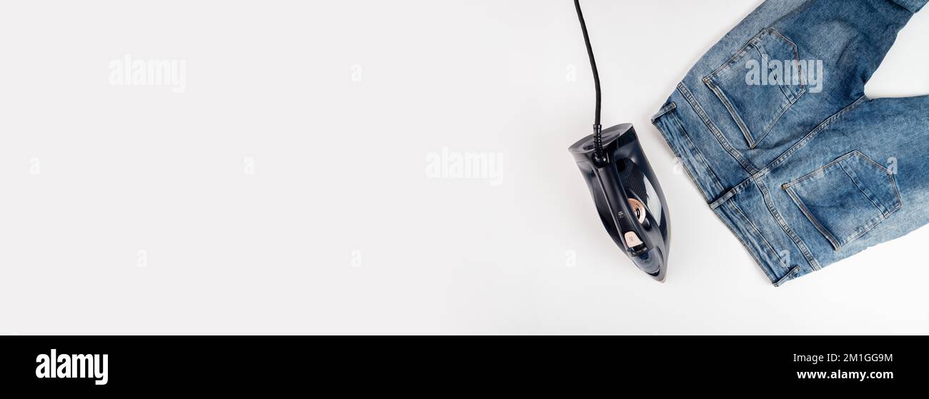 iron and unironed clothes. Ready for ironing banner Stock Photo - Alamy