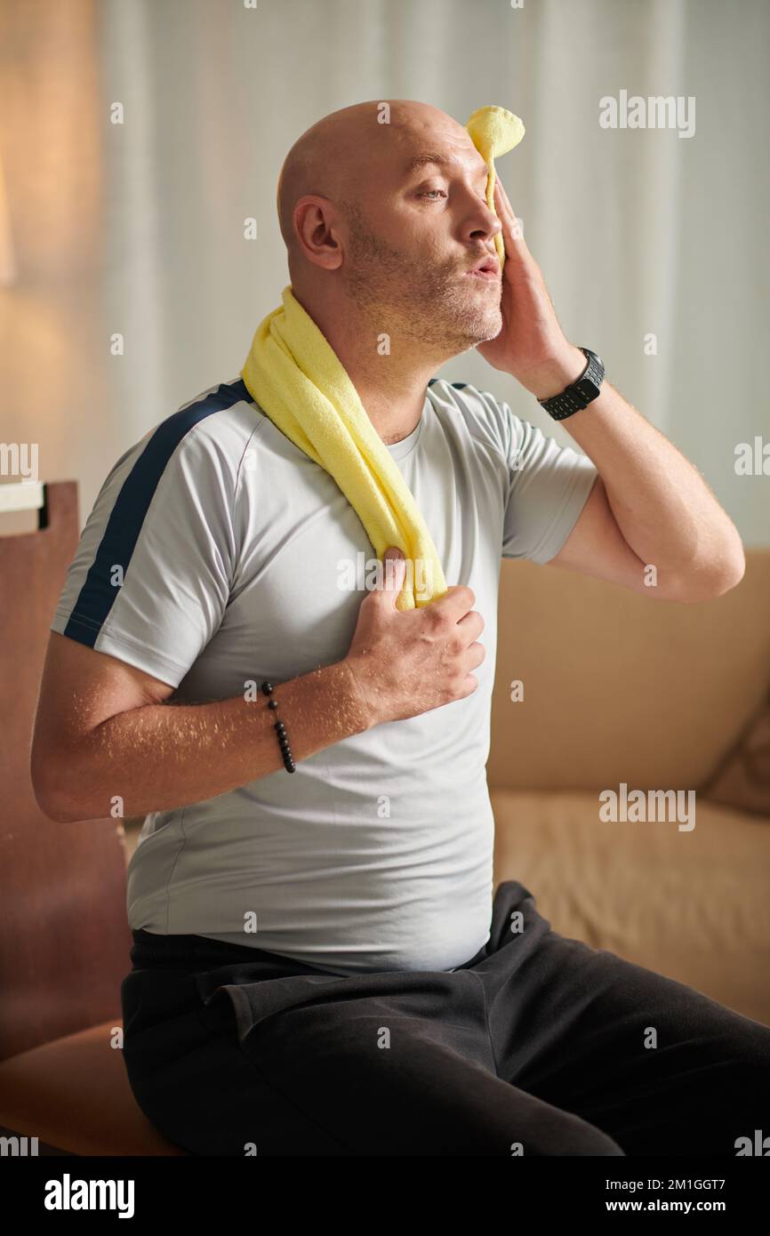 Muscular man wiping off sweat hi-res stock photography and images - Alamy