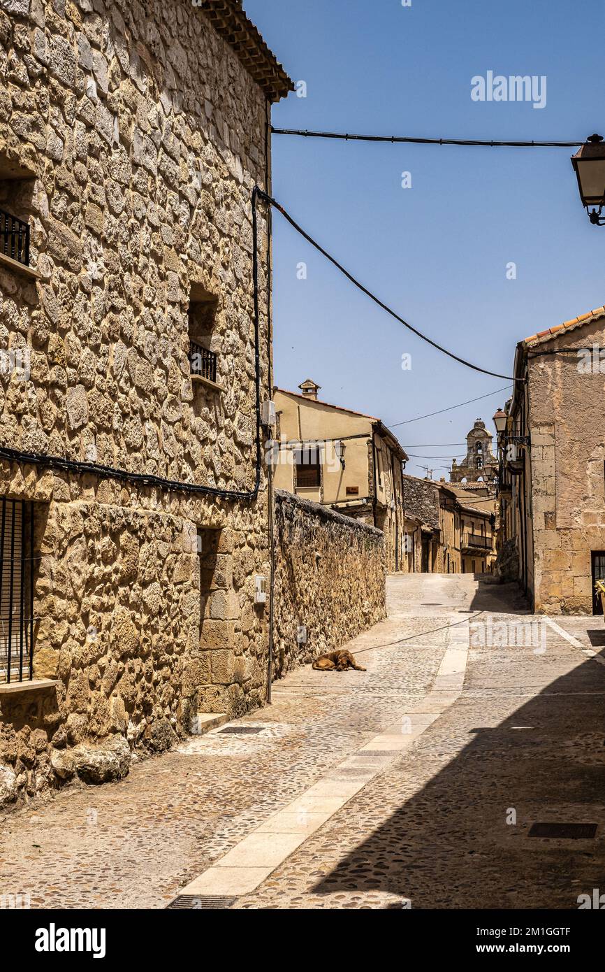 Medieval village with stone houses, cobblestone streets, old doors and ...