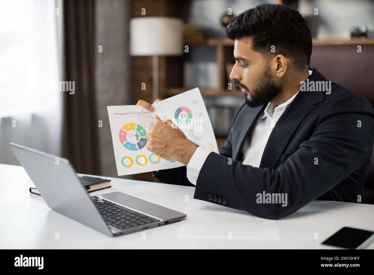 Serious marketing professional man in suit talking to client on video ...