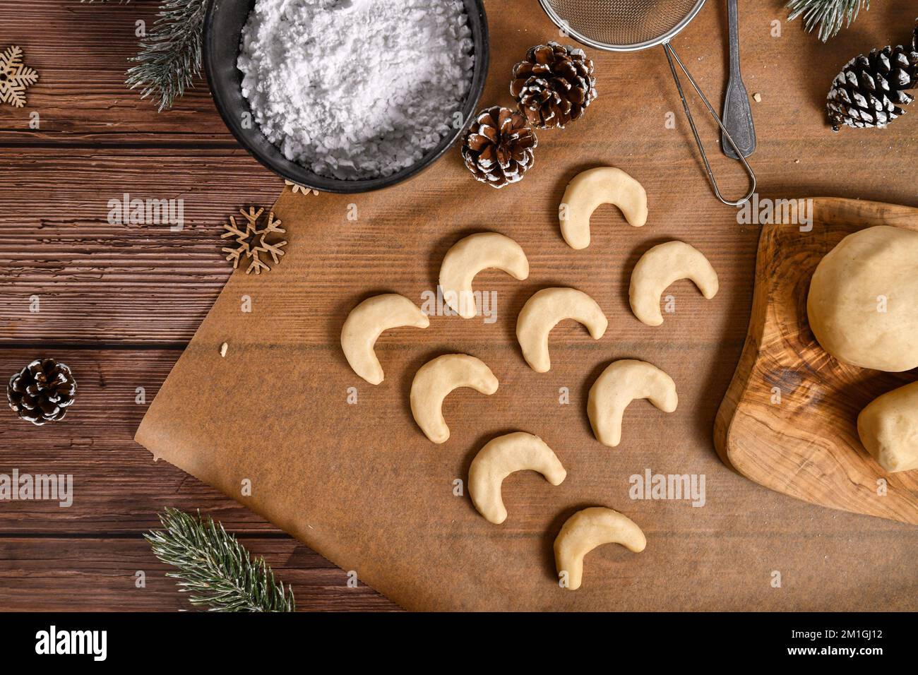 Baking traditional German or Austrian crescent shaped christmas cookies ...