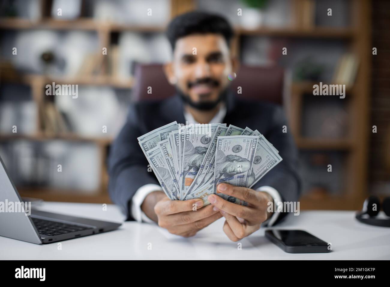 Hands counting dollars on laptop hi-res stock photography and images ...