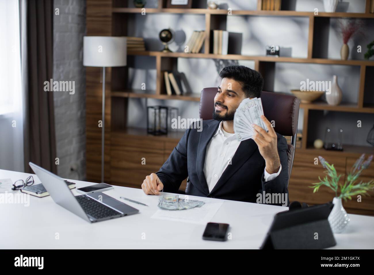 Accounting, taxes and finances concept - young bearded attractive man ...