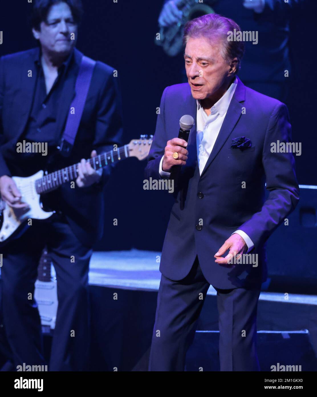 A vertical shot of Frankie Vallie performing on stage at the Hard Rock ...