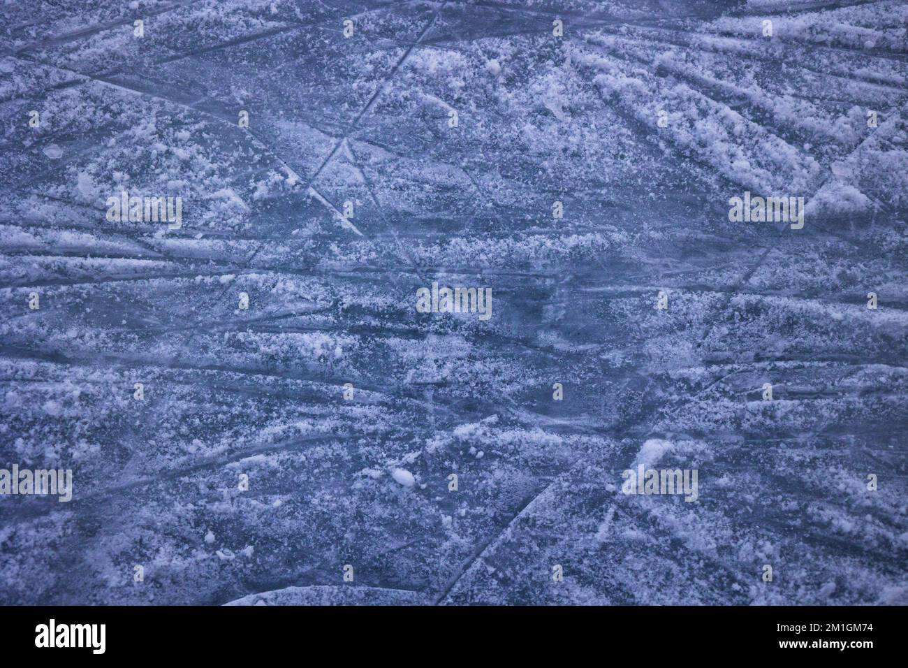 BACKGROUND TEXTURE - Ccloseup of ice on a skating rink with marks made ...