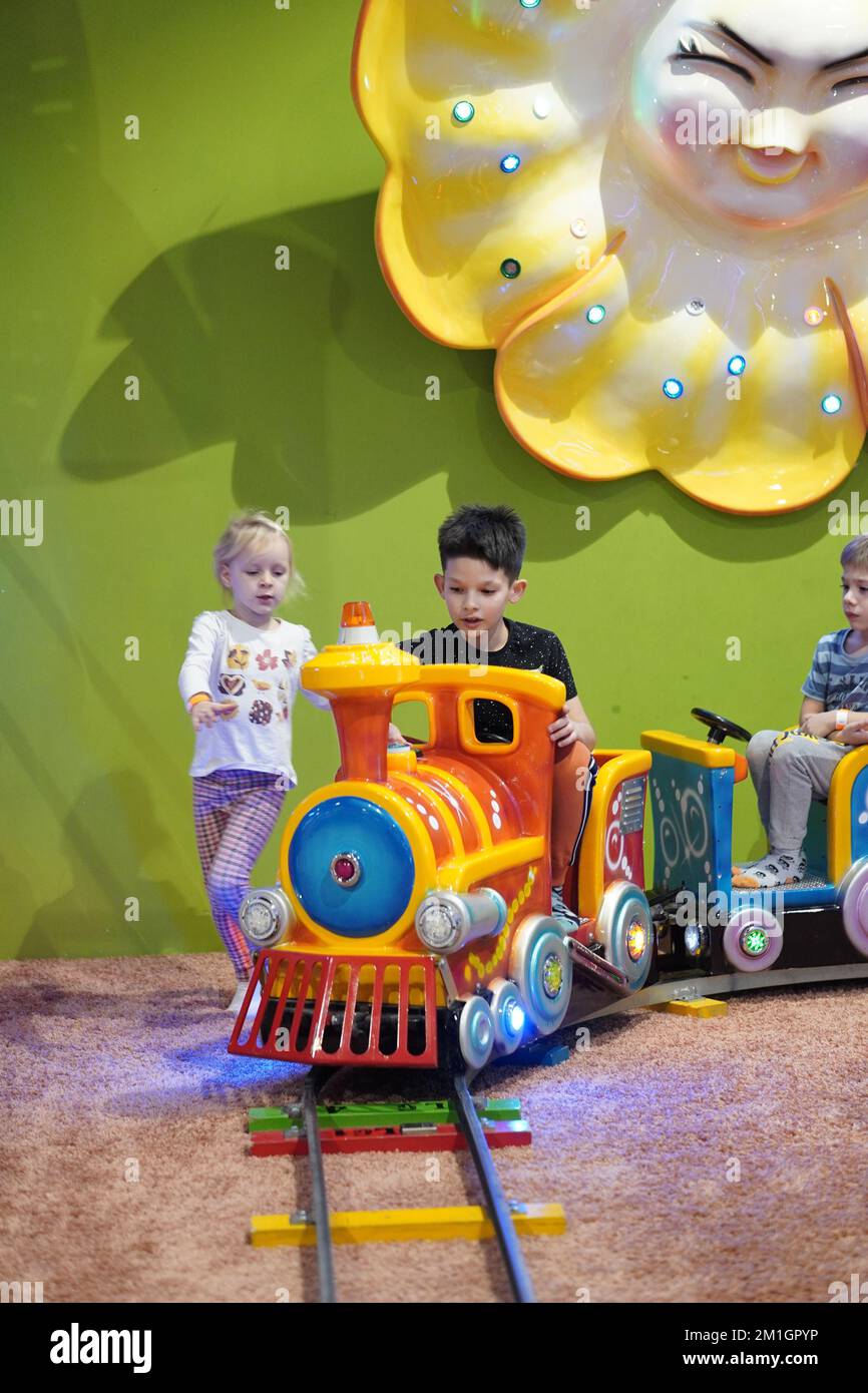 The kids on a train and track attraction inside the Lider playground ...
