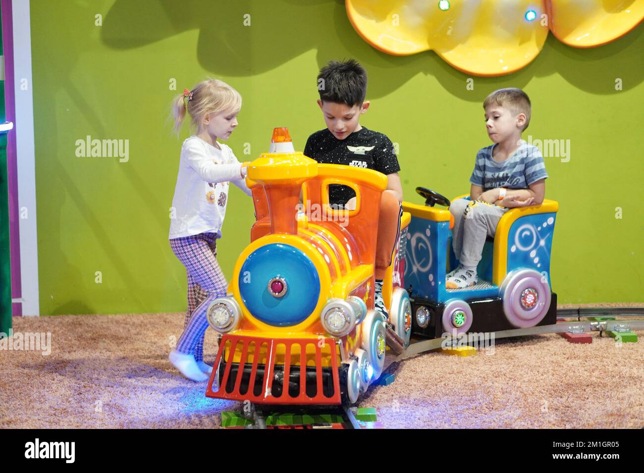 The kids on a train and track attraction inside the Lider playground ...
