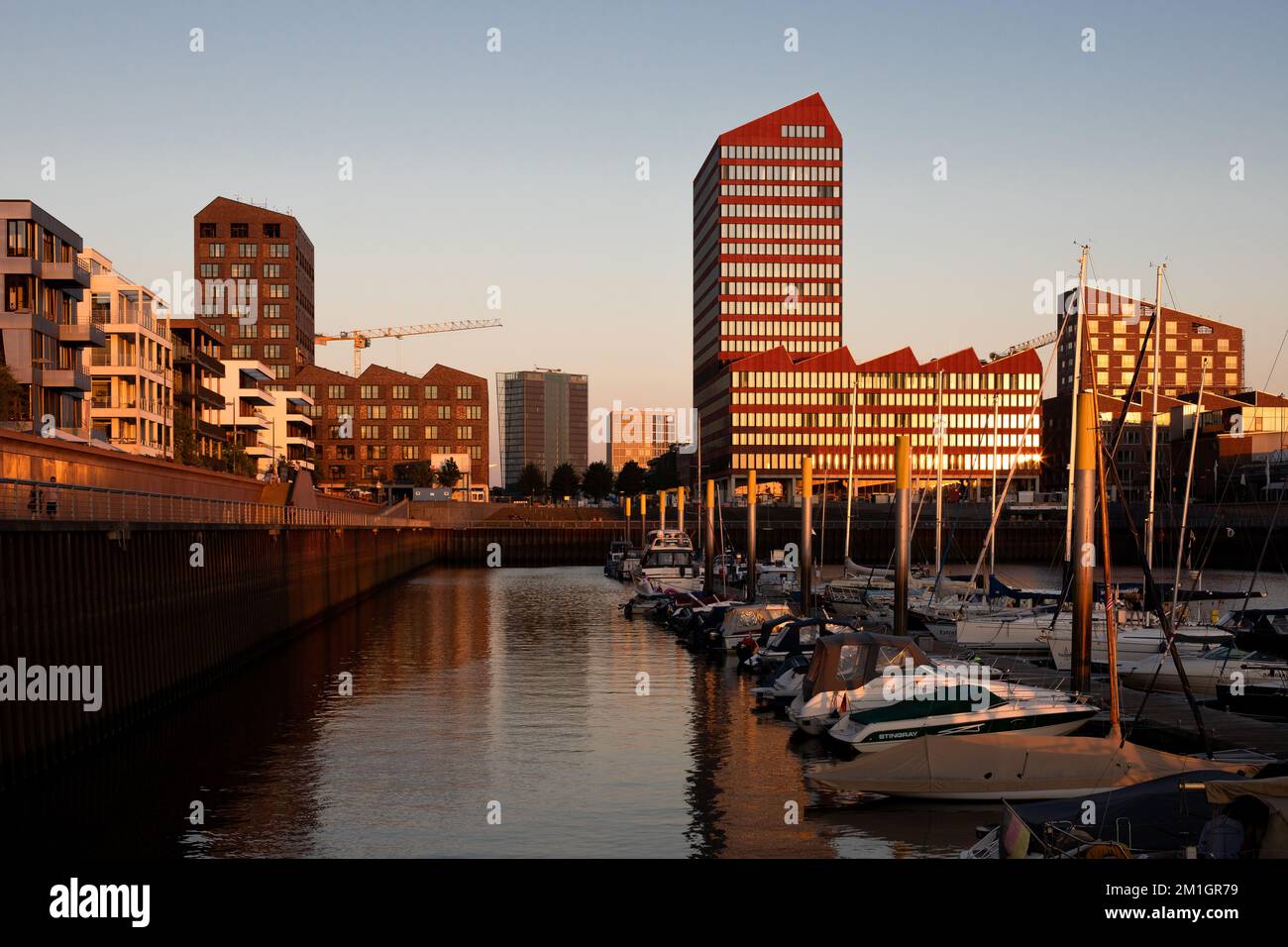 sunset reflecting on newly built modern office and residential ...