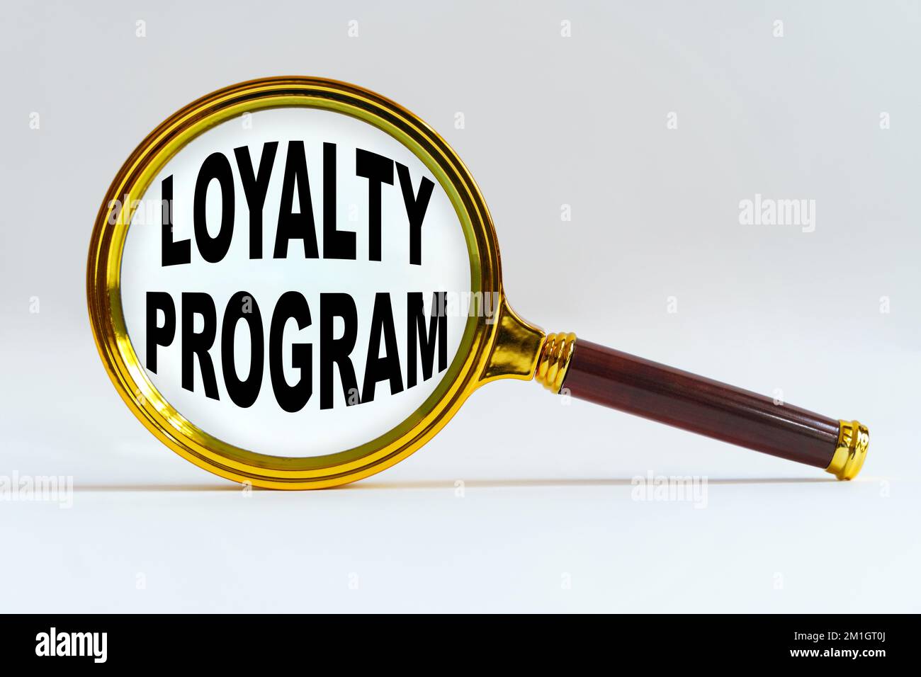 Finance and economics concept. Magnifier on a white background, inside ...