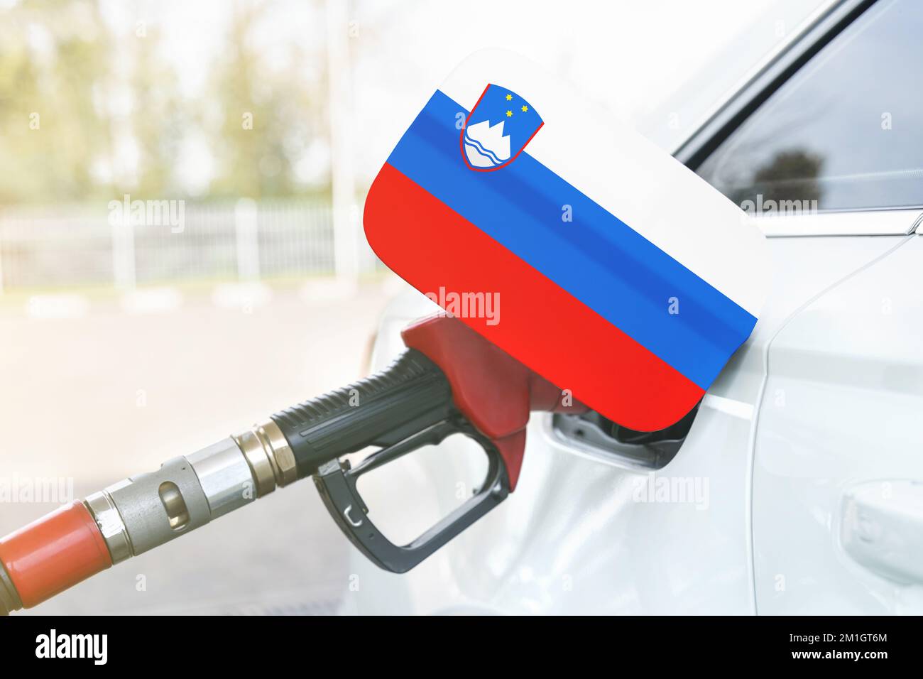 Energy and economy concept. Flag of Slovenia on the car's fuel filler ...