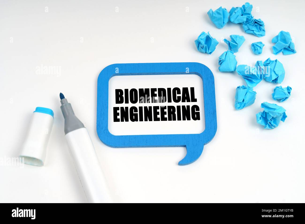 Medicine and health. On a white surface are crumpled blue paper, a ...