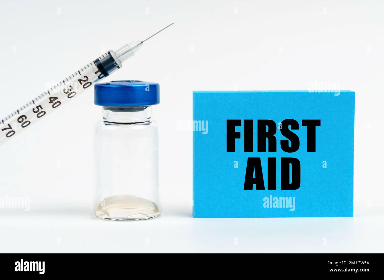 Medicine concept. On the table is a syringe, an injection and a blue ...