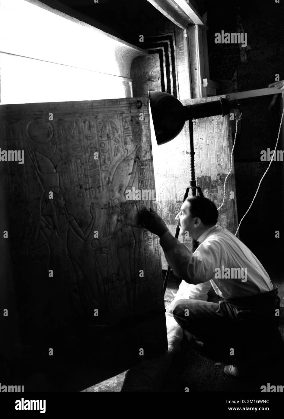 Howard Carter is pictured here looking through the doors of the second ...