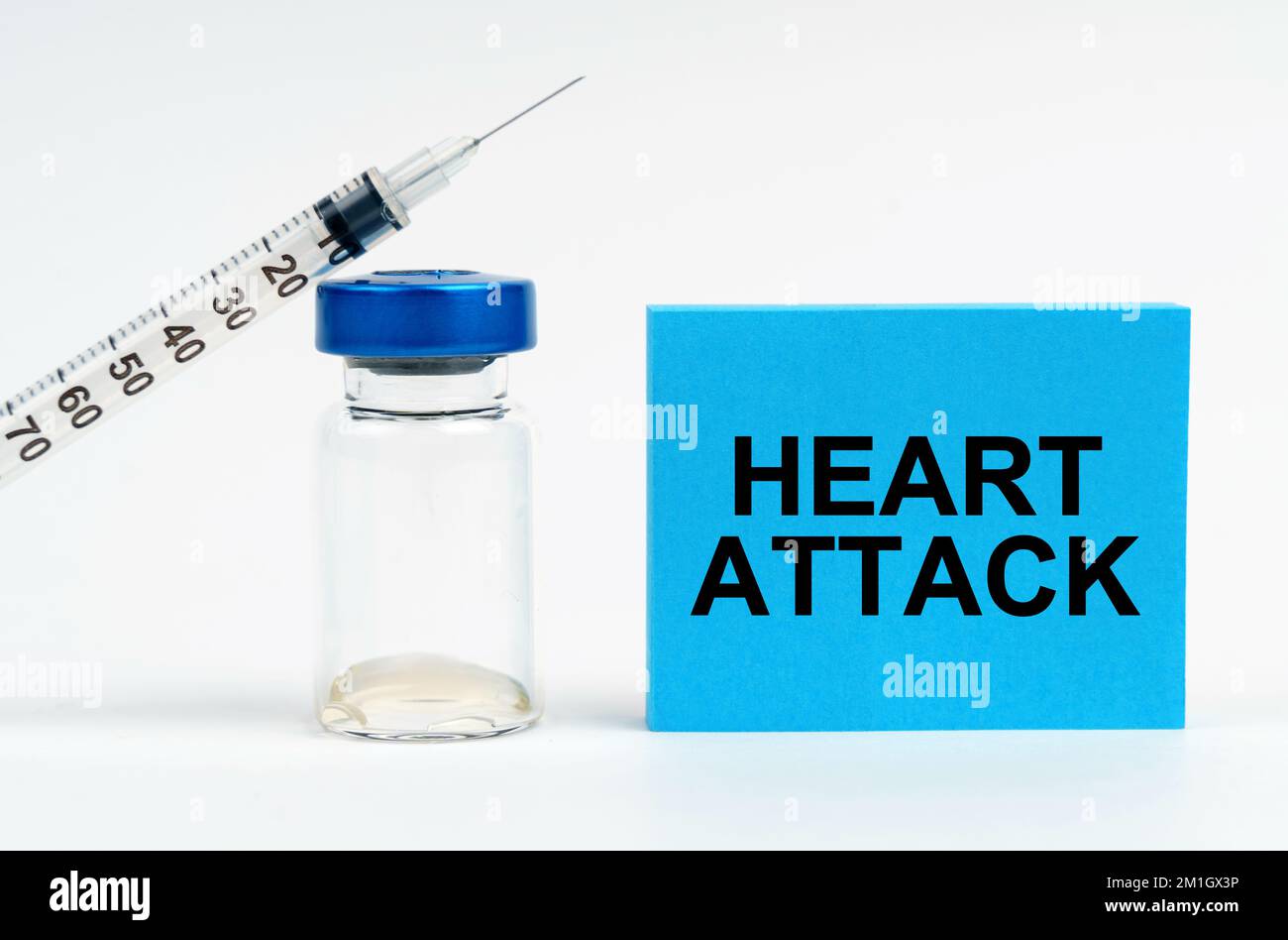 Medicine concept. On the table is a syringe, an injection and a blue ...