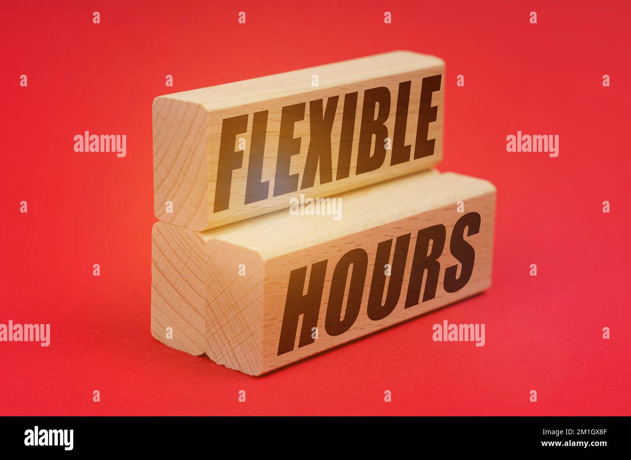 Business and economy concept. On a red background, wooden blocks with ...